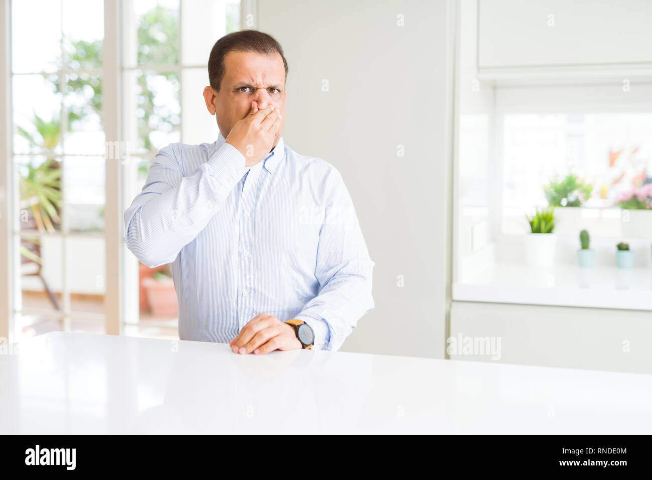 Old man smells hi-res stock photography and images - Alamy