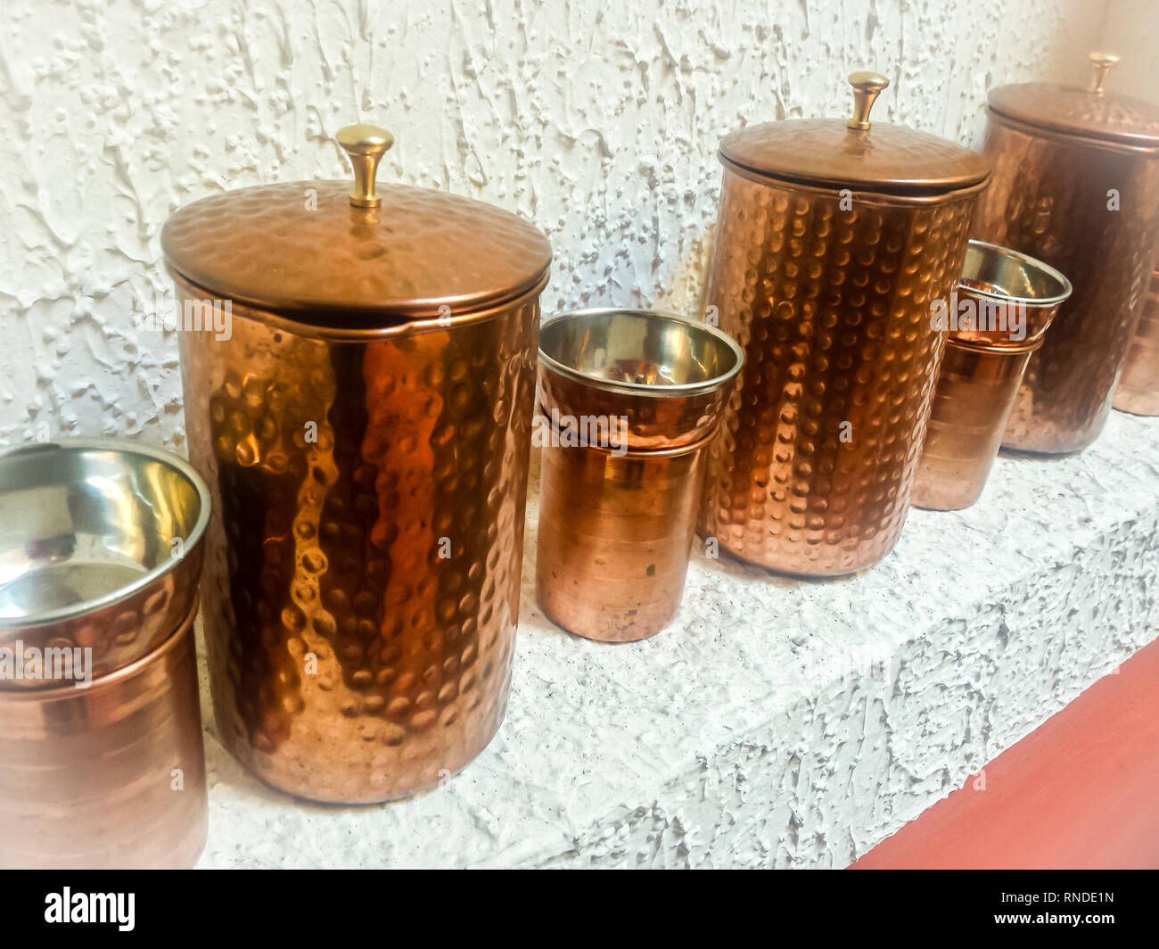 A Row of Indian Copper Coffee Pots and Cups Stock Photo - Alamy