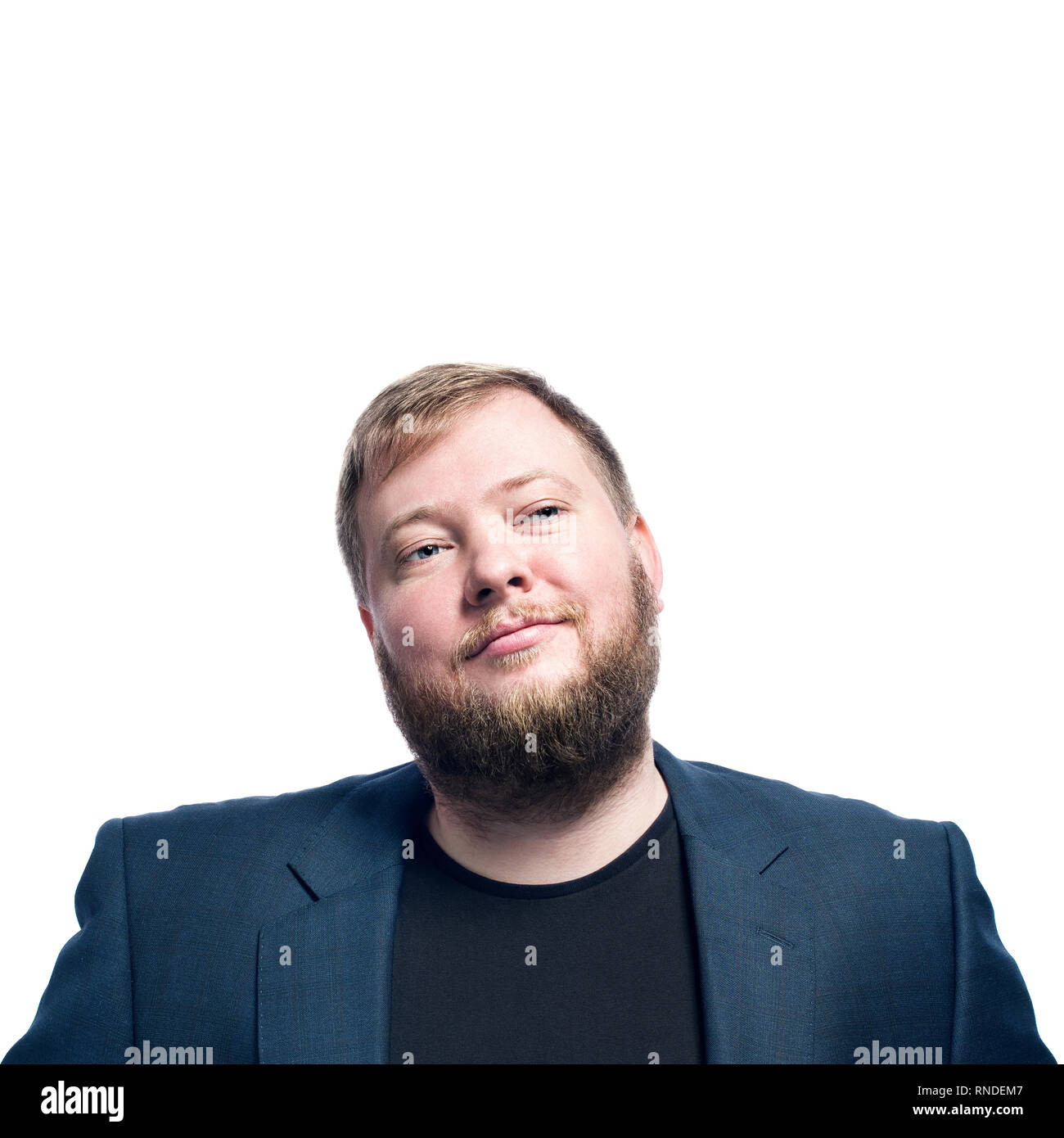 Close-up portrait of a brooding bearded man. Blue jacket in business ...