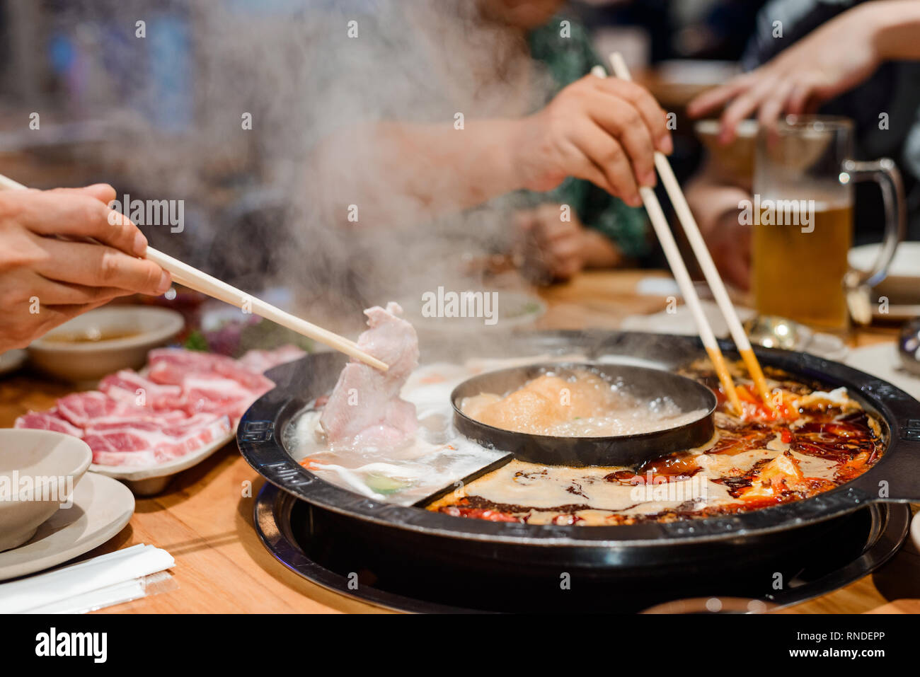 People cooking and eating food Stock Photo - Alamy