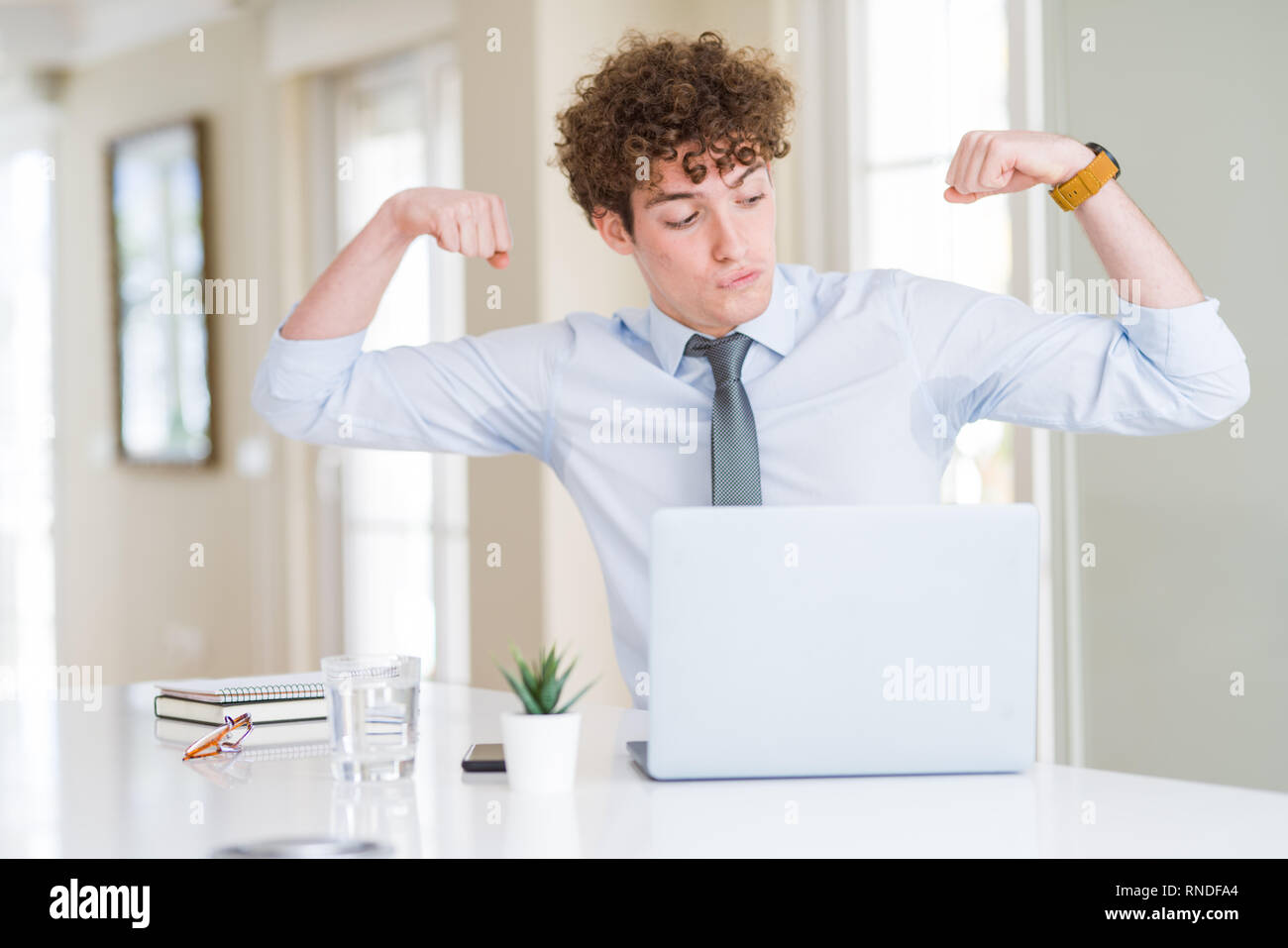Young business man working with computer laptop at the office showing ...
