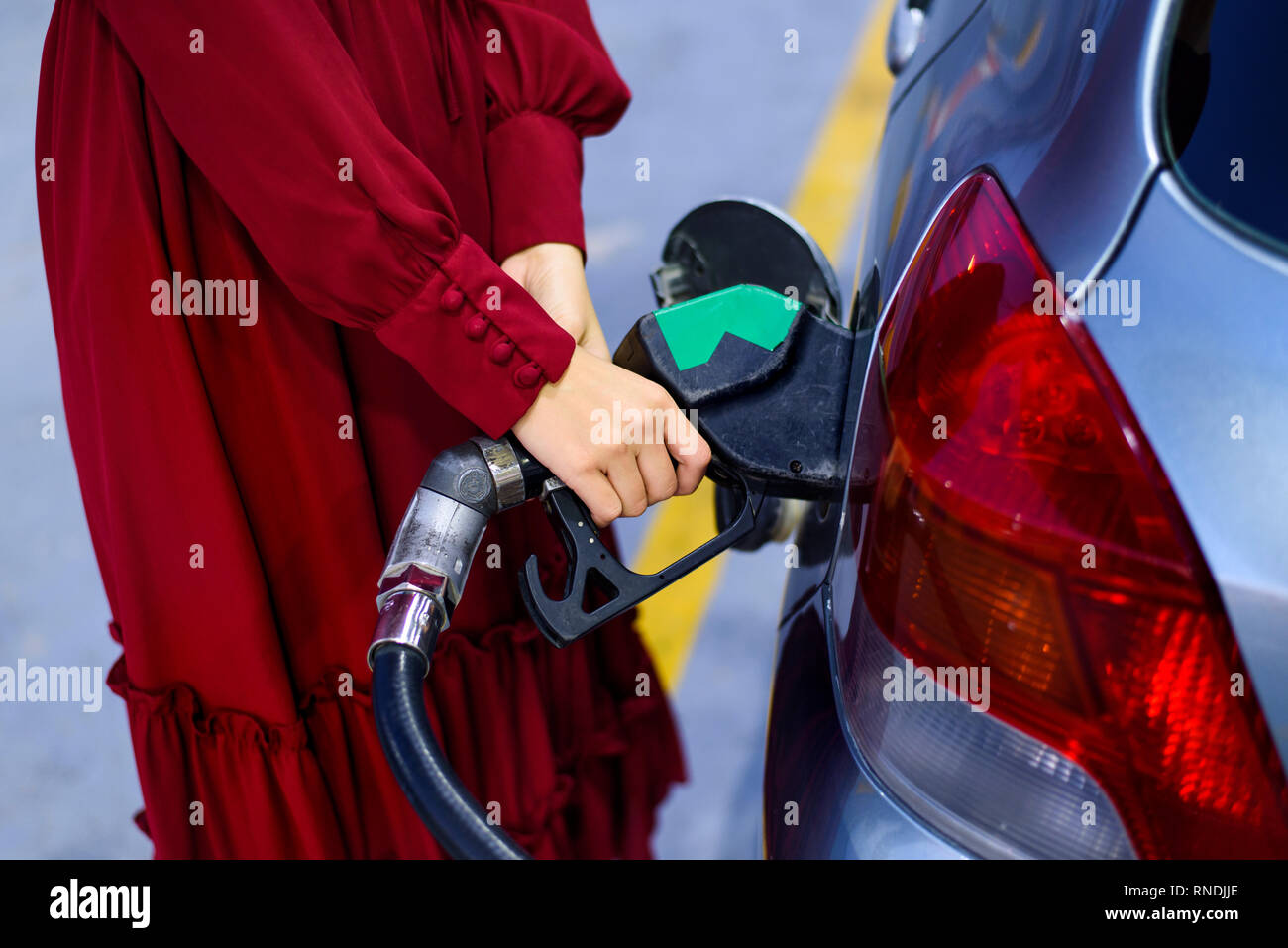 Woman at gas pump hi-res stock photography and images - Alamy