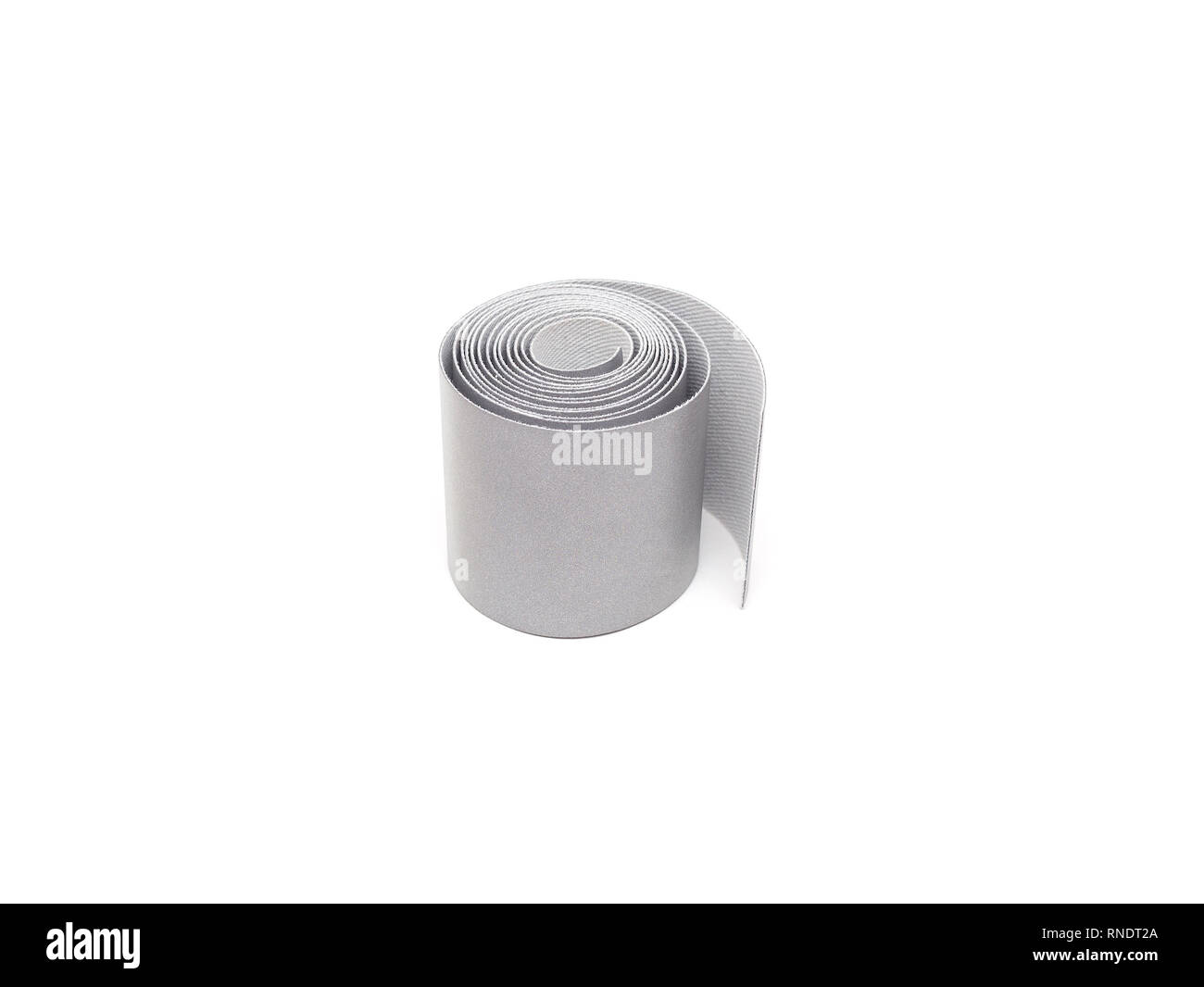 A roll of reflective tape on a white background, close-up, isolate ...