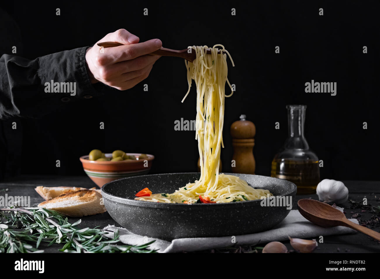 Serving italian pasta from pan. Traditional spaghetti meal with ...
