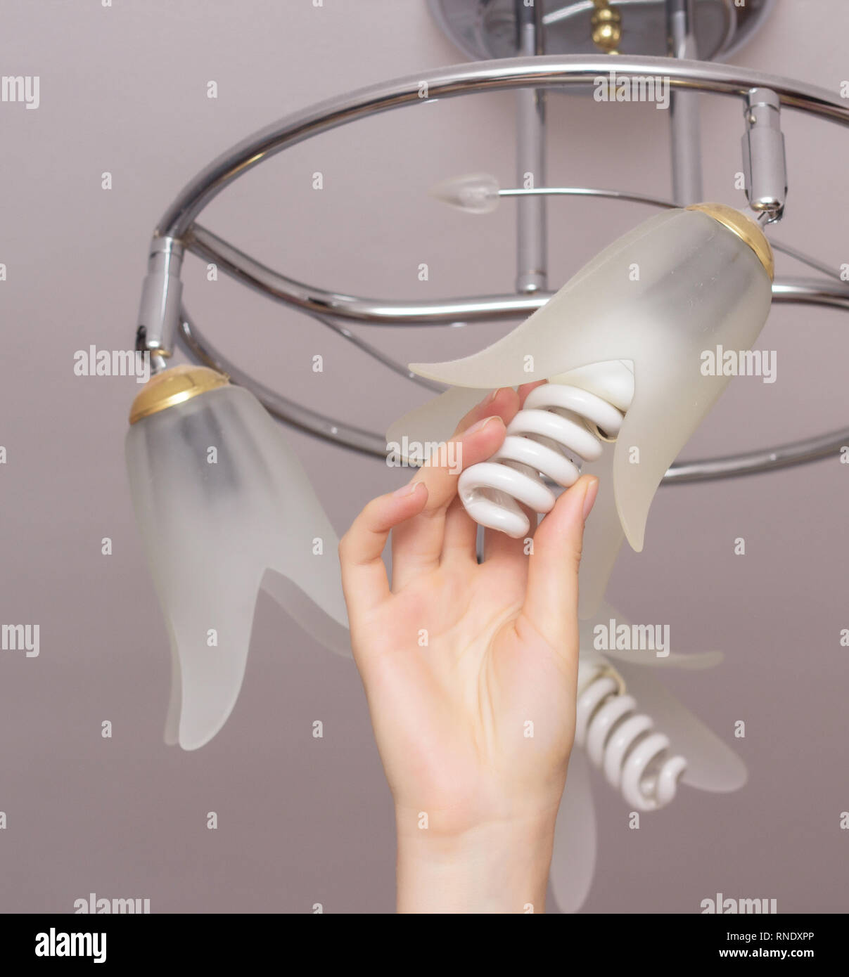 Hand changing light bulb close hi-res stock photography and images - Alamy