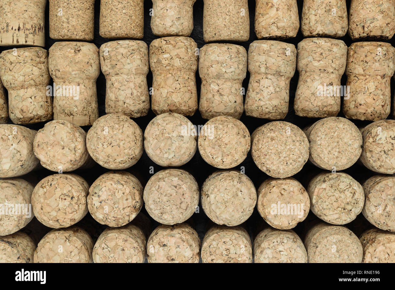 Background of champagne corks. Half of corks lying, half of them ...