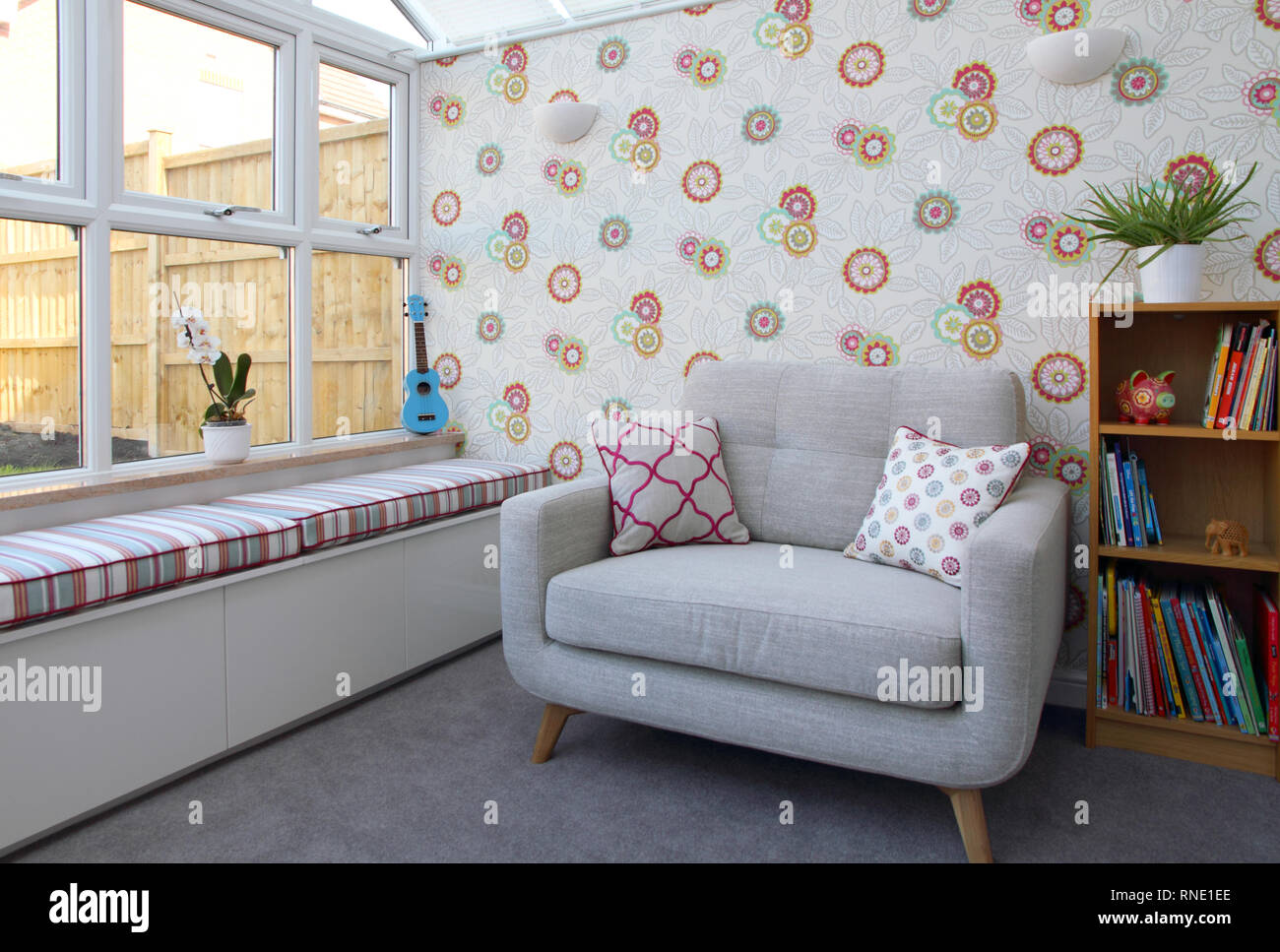 Living room with window seat with underneath storage Stock Photo - Alamy