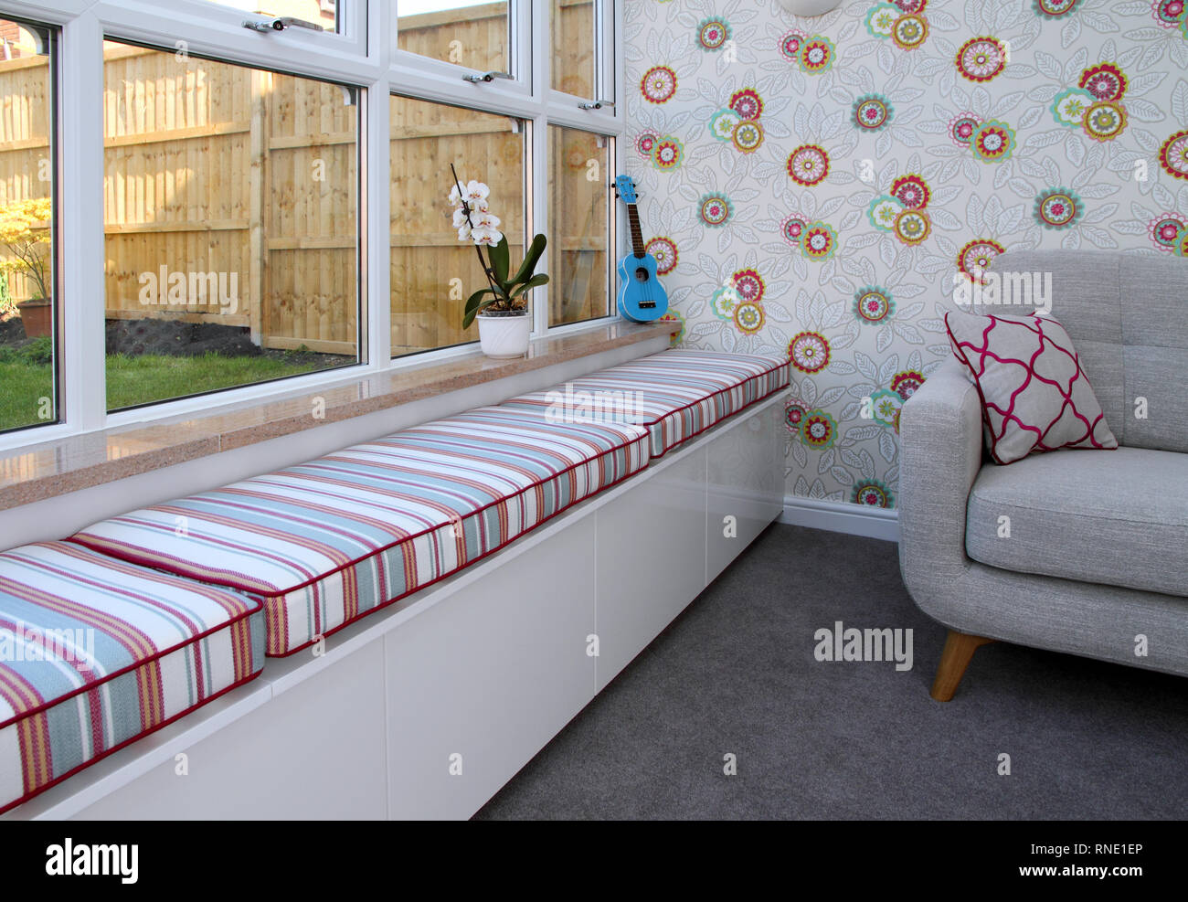 Living room with window seat with underneath storage Stock Photo - Alamy