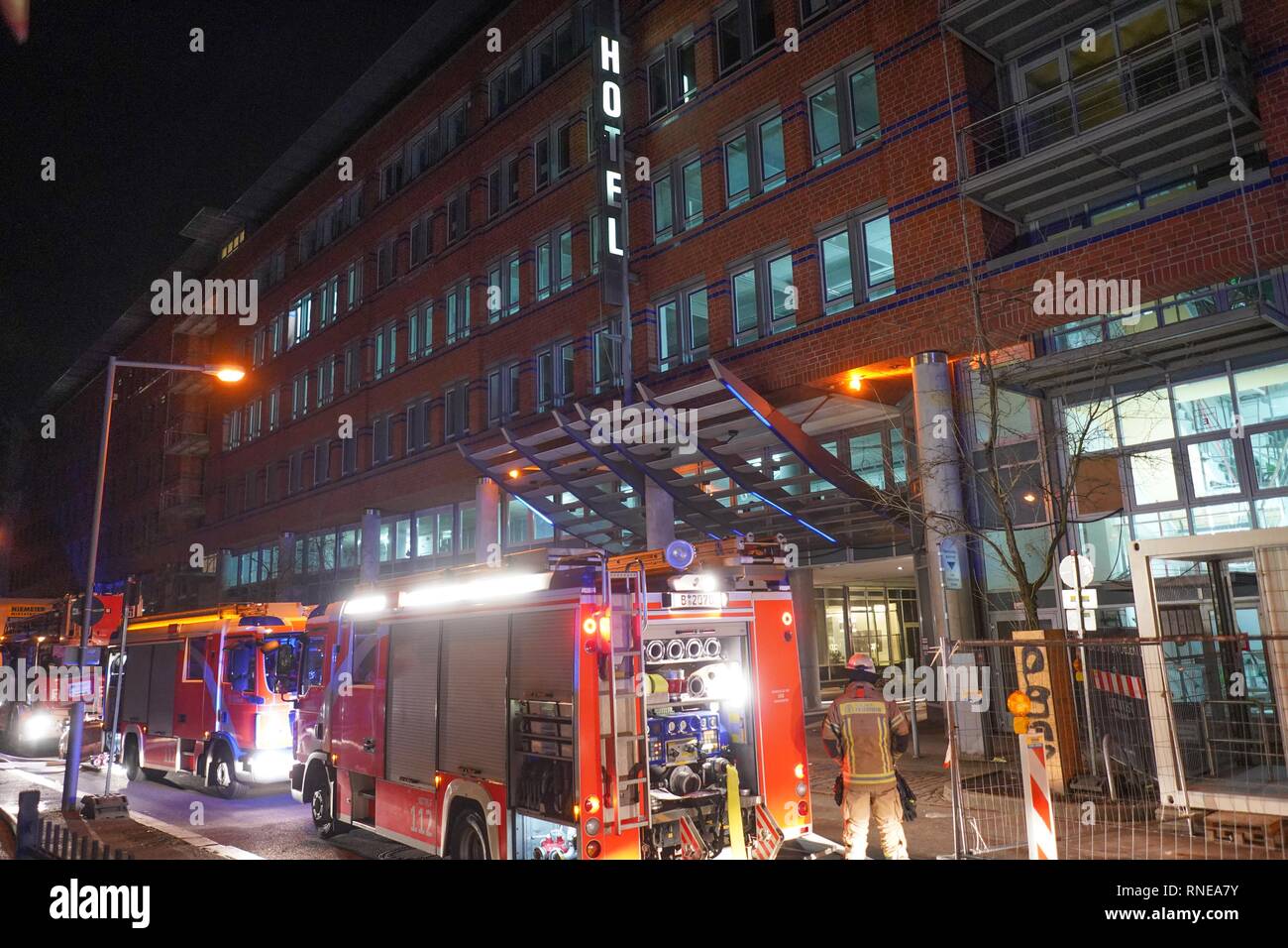 Berlin, Germany. 19th Feb 2019. Firefighters extinguish a fire in a ...