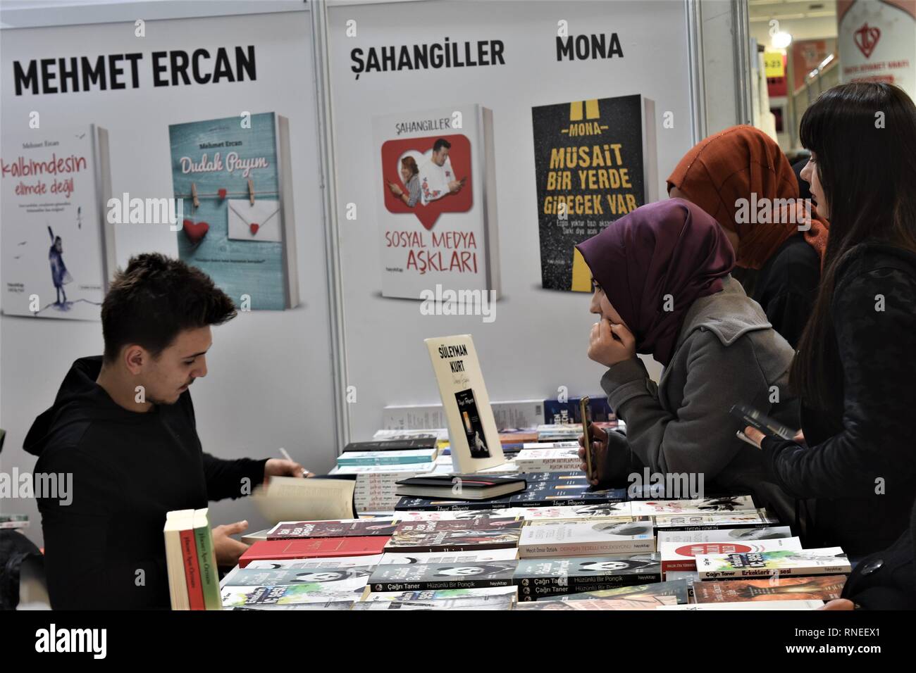 16 February 2019, Turkey, Ankara: A Turkish author autographs a book ...