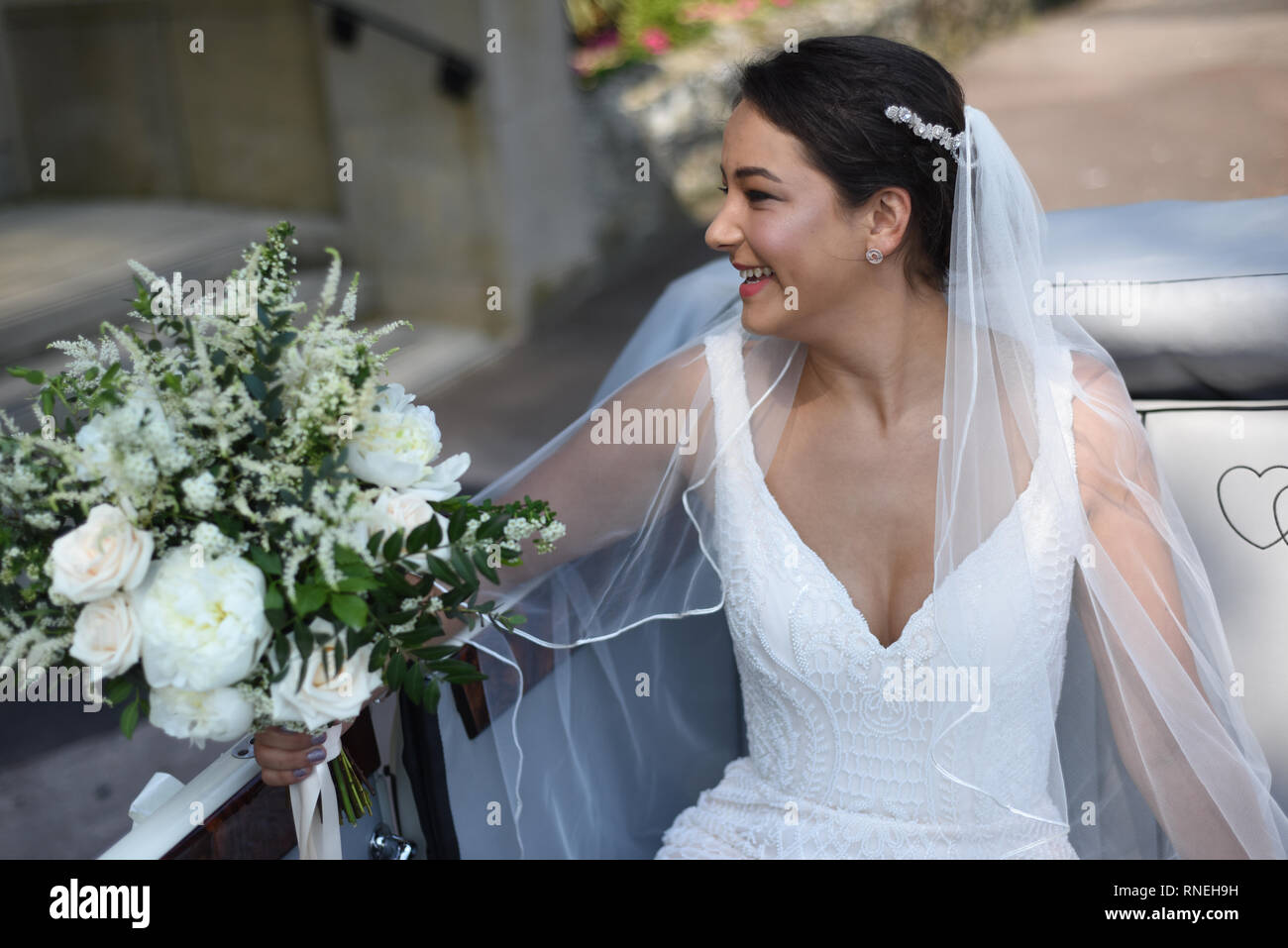 Beautiful white couple get married by the sea on a glorious Summer day ...