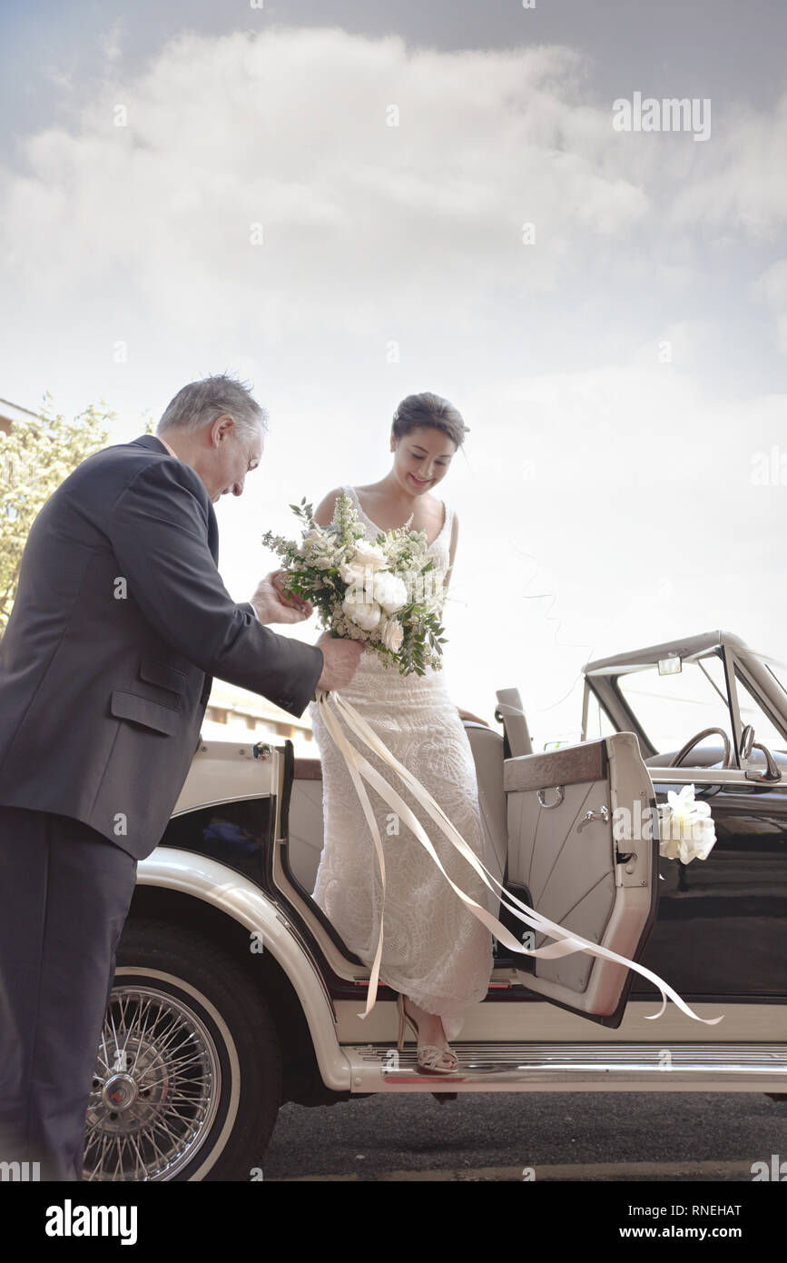 Beautiful white couple get married by the sea on a glorious Summer day ...