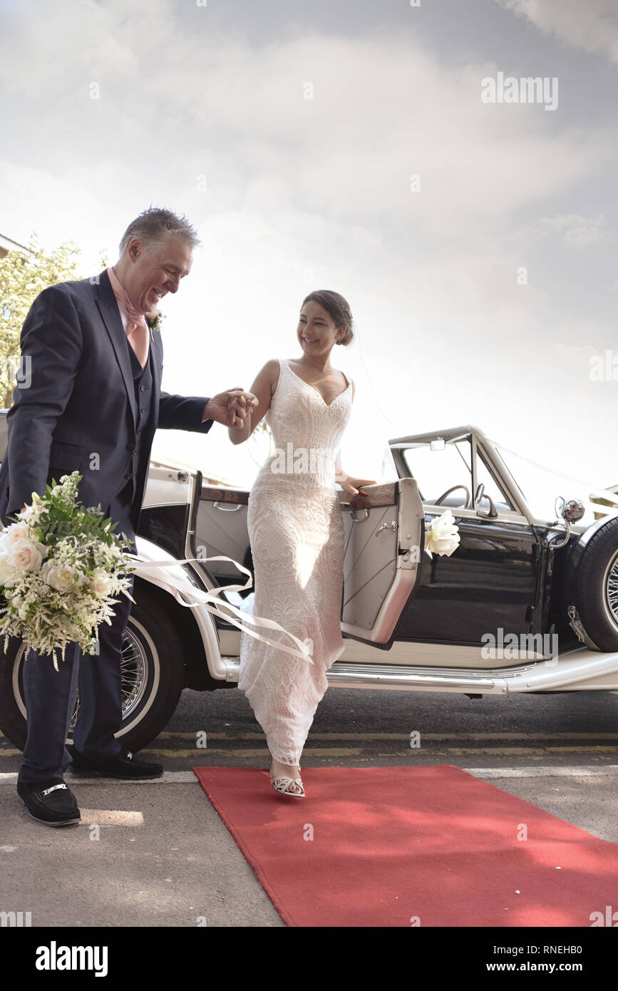 Beautiful white couple get married by the sea on a glorious Summer day ...