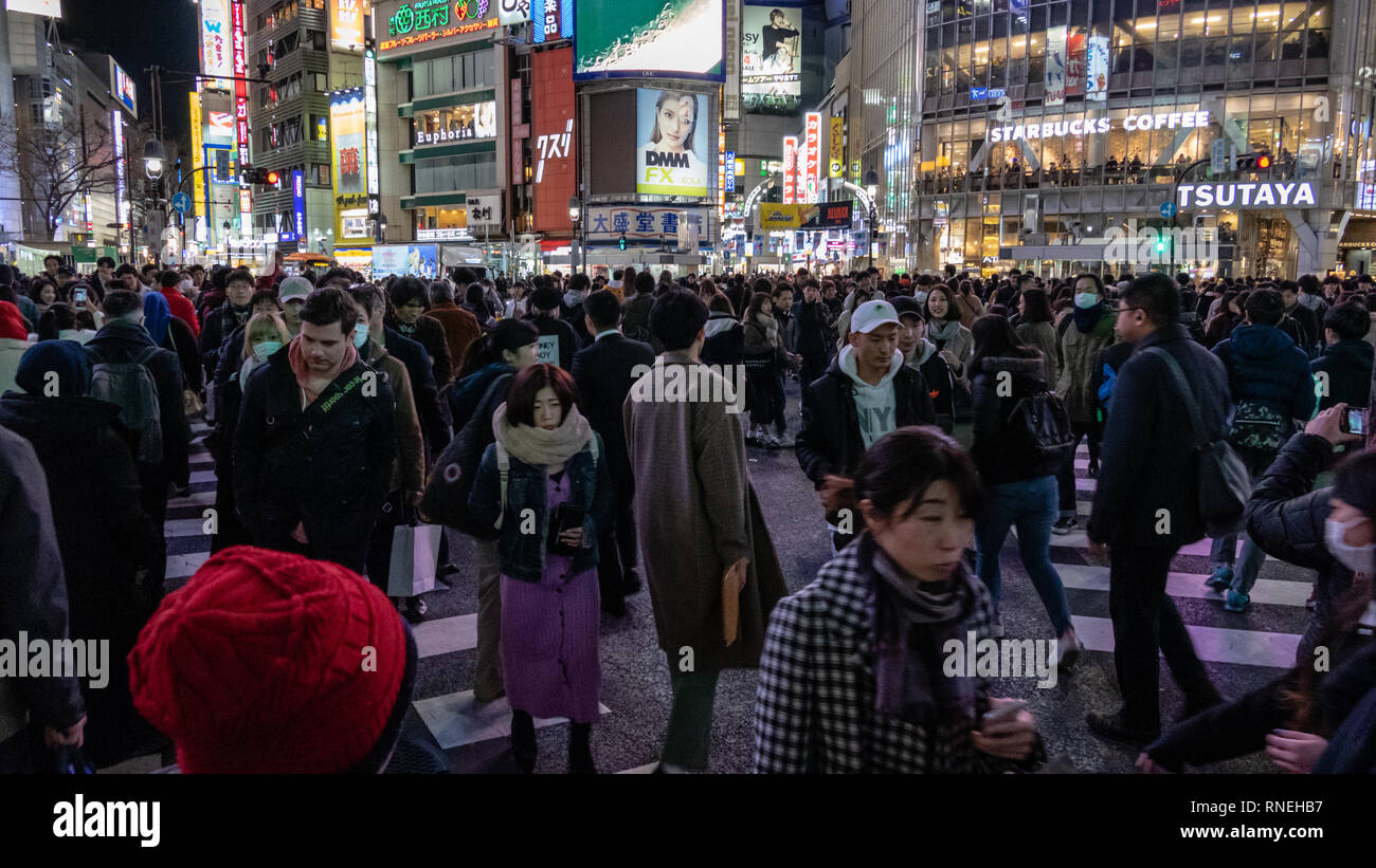TOKYO, JAPAN - DECEMBER 23, 2012: Pedestrians cross at Shibuya Crossing ...
