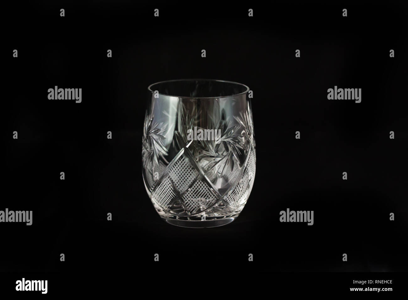 Vintage empty crystal glass on the black background Stock Photo - Alamy