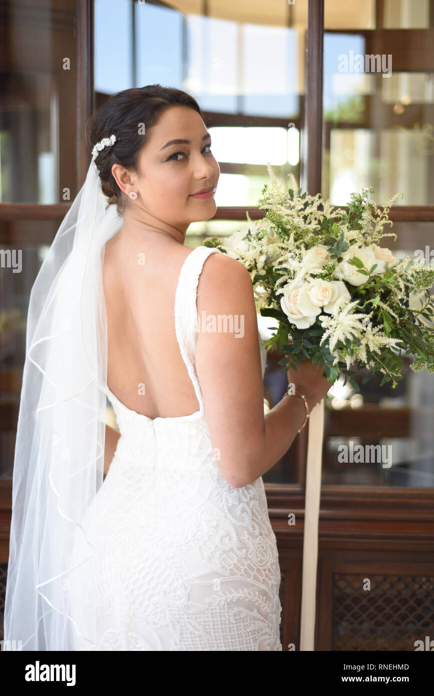 Beautiful white couple get married by the sea on a glorious Summer day ...