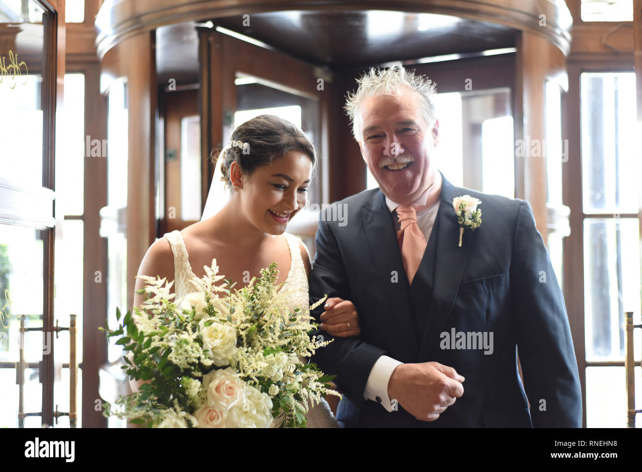 Beautiful white couple get married by the sea on a glorious Summer day ...