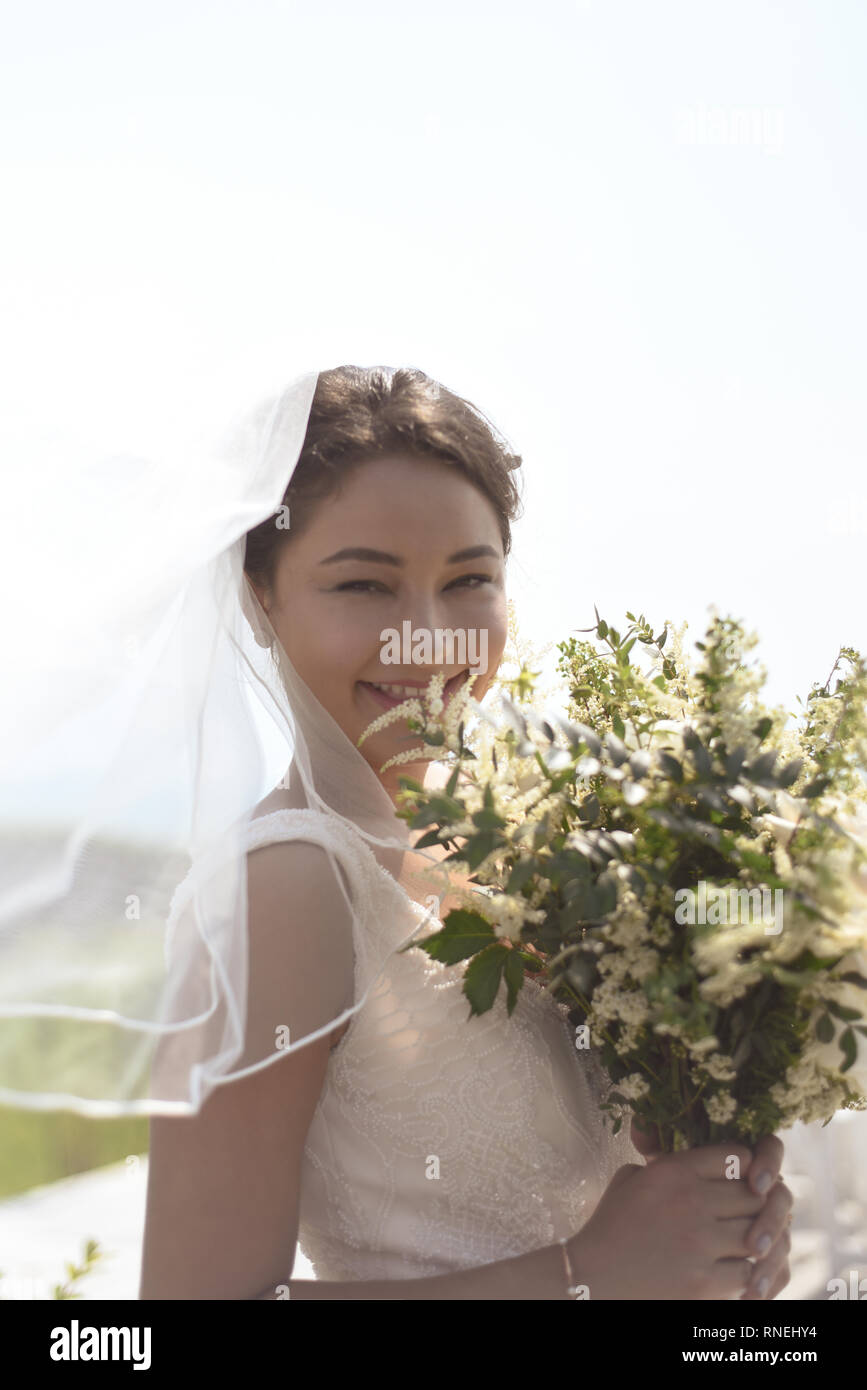 Beautiful white couple get married by the sea on a glorious Summer day ...
