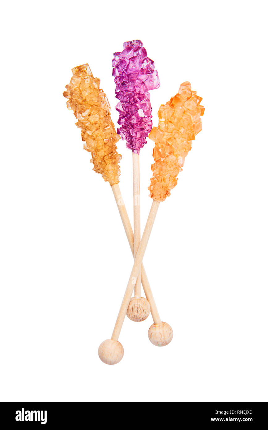 Rock candy or orange and purple sugar candy isolated on white ...