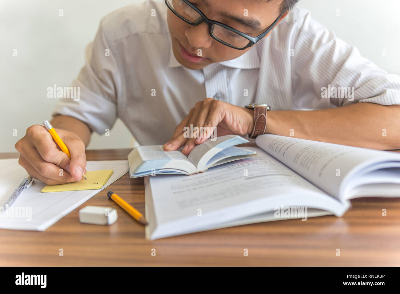 Student taking notes on books hi-res stock photography and images - Alamy
