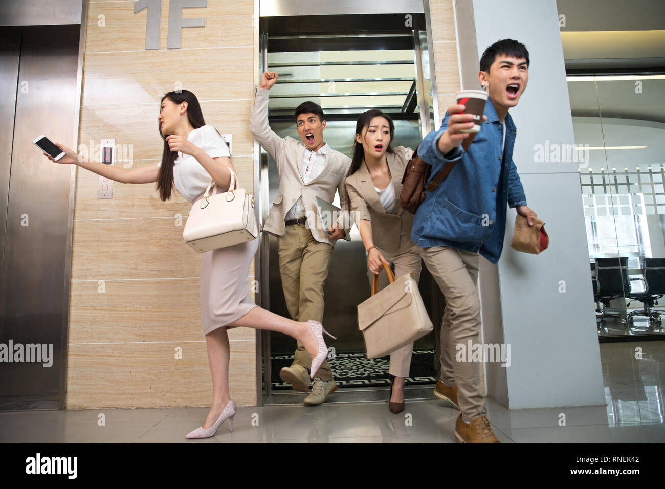 Business men and women crowded elevators Stock Photo - Alamy