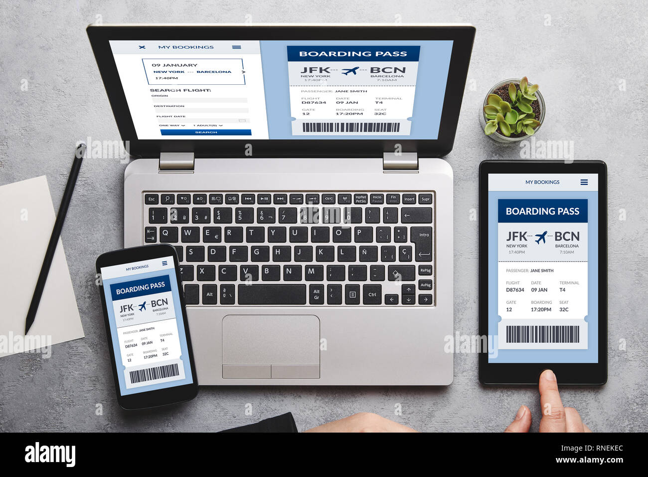 Boarding pass concept on laptop, tablet and smartphone screen over gray ...