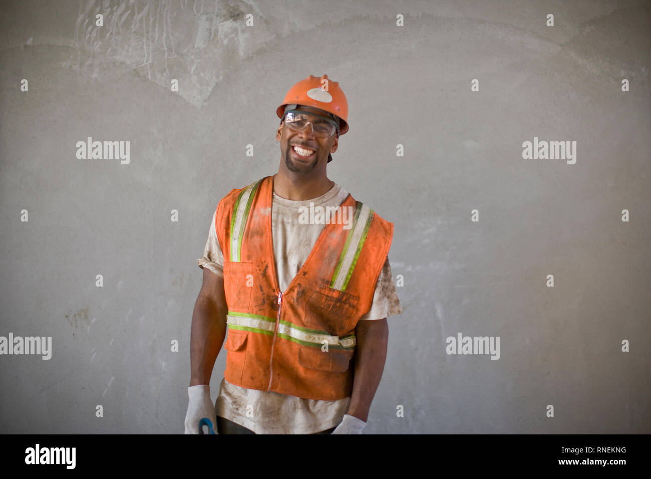 Workers wearing hard hats and reflective vests hi-res stock photography ...
