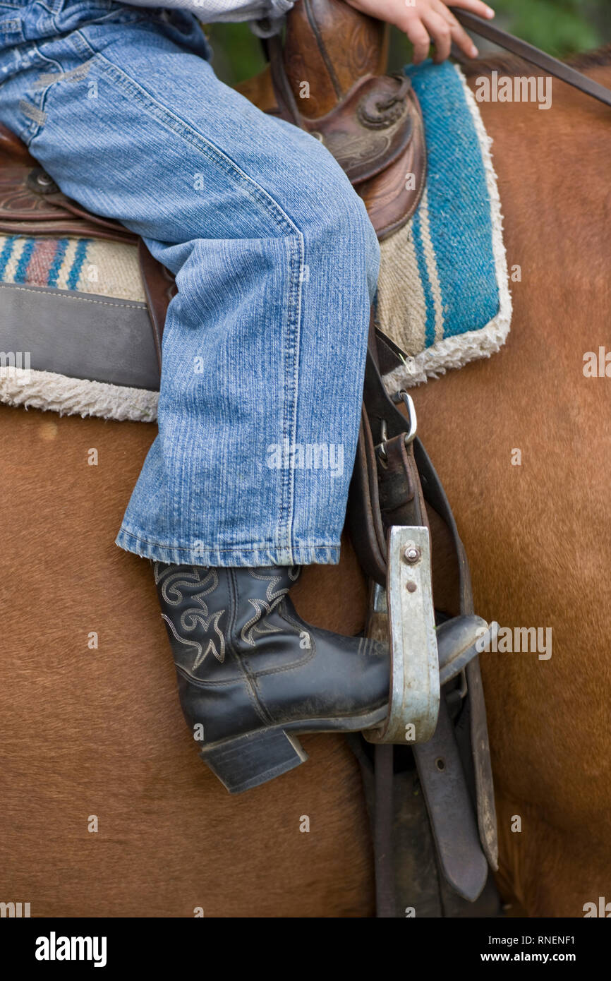 Close-up of cowboy boot in stirrup on horseback Stock Photo - Alamy