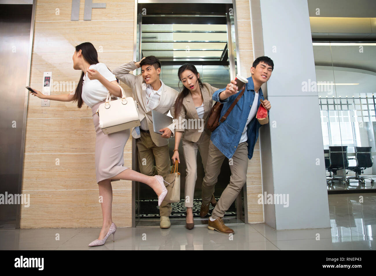 Business men and women crowded elevators Stock Photo - Alamy