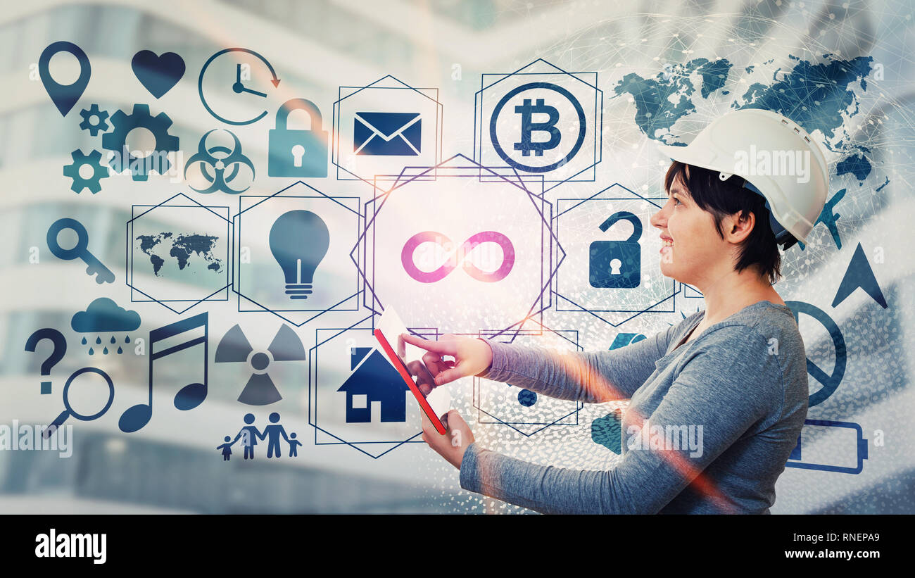 Side view woman engineer wearing protective helmet using tablet ...