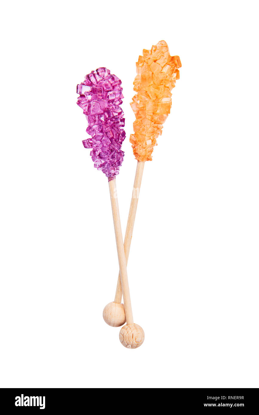 Rock candy or orange and purple sugar candy isolated on white ...