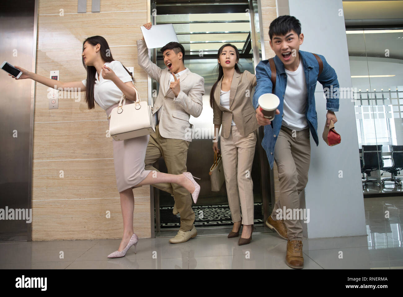 Business men and women crowded elevators Stock Photo - Alamy