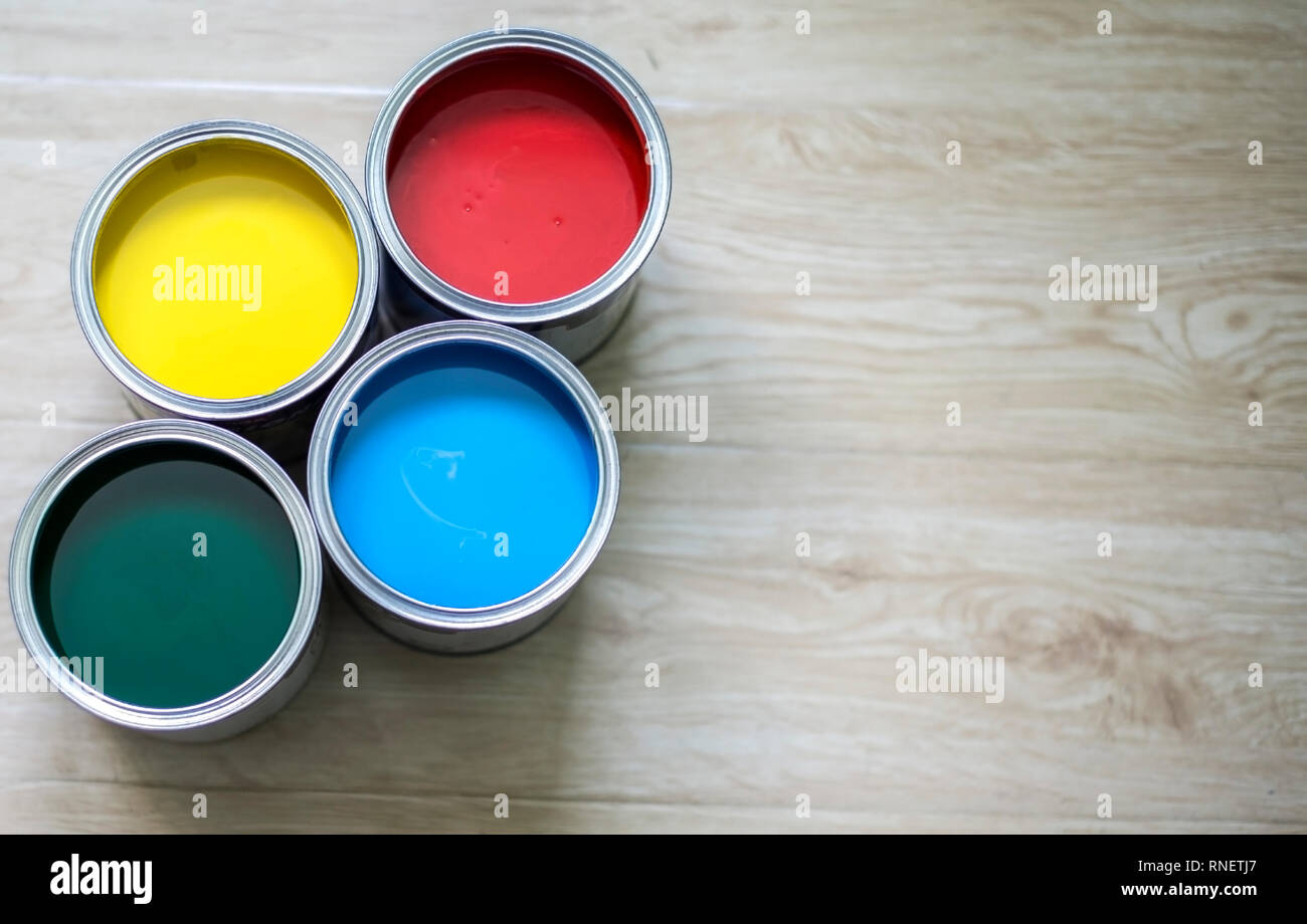 Four cans of paint ready for use Stock Photo - Alamy