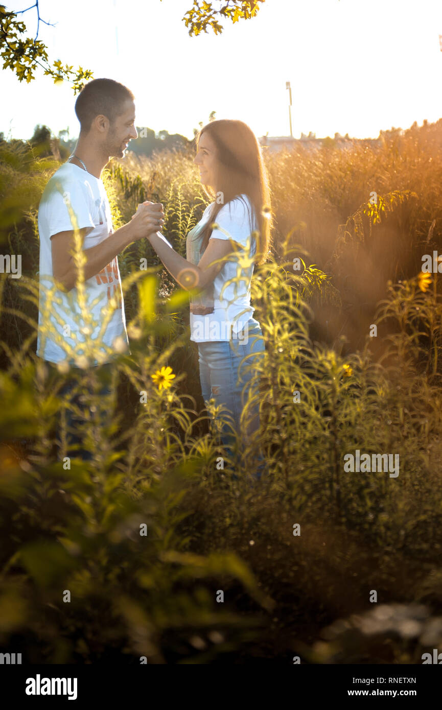 Young couple in love in summer nature Stock Photo - Alamy