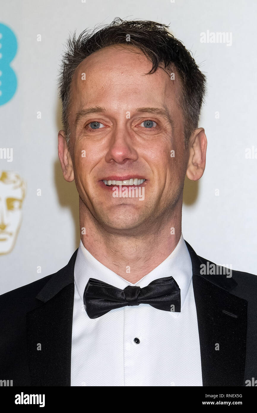 Jeff Whitty poses on the red carpet at the British Academy Film Awards ...