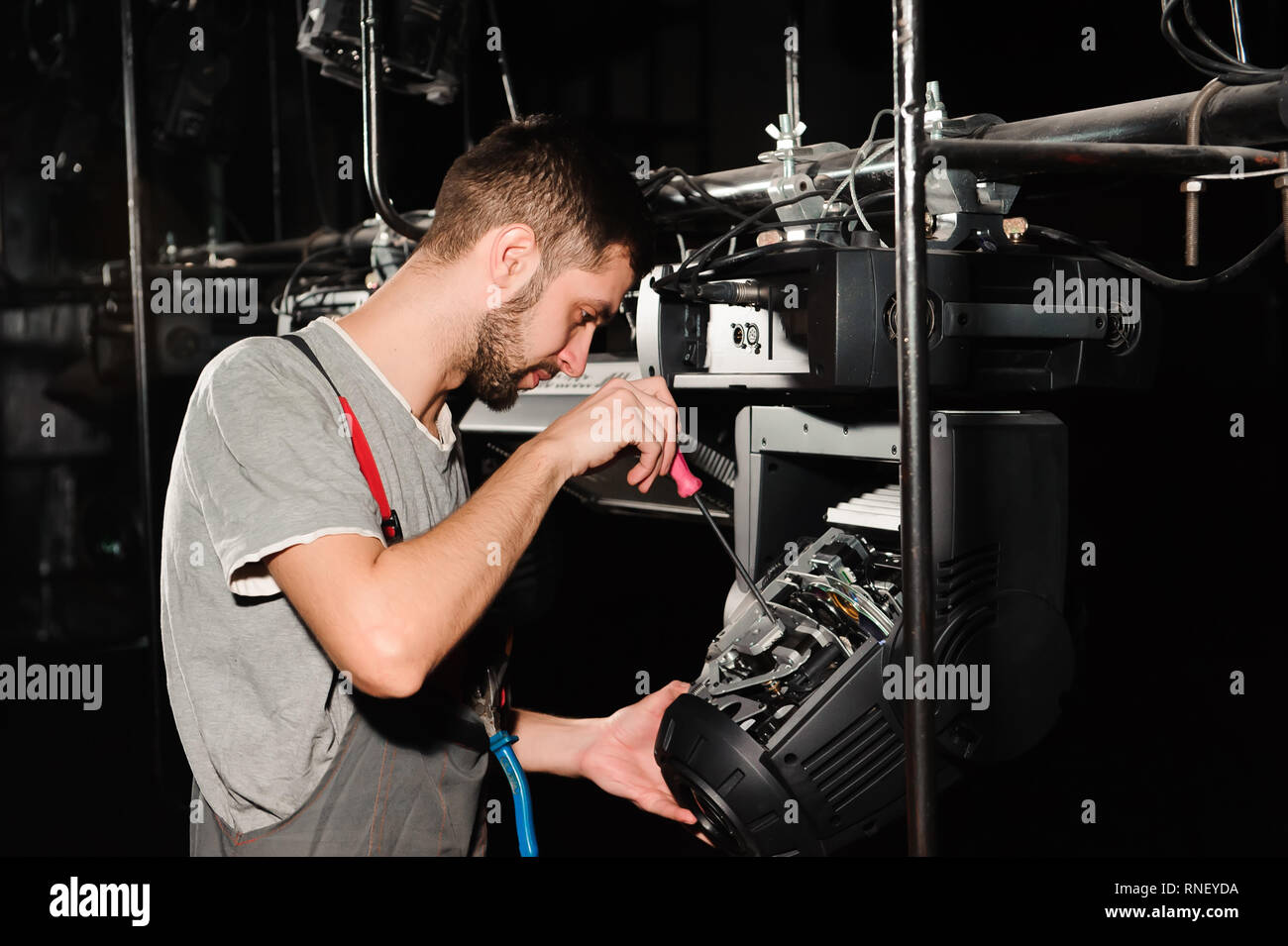 The lighting engineer adjusts the lights on the stage Stock Photo - Alamy
