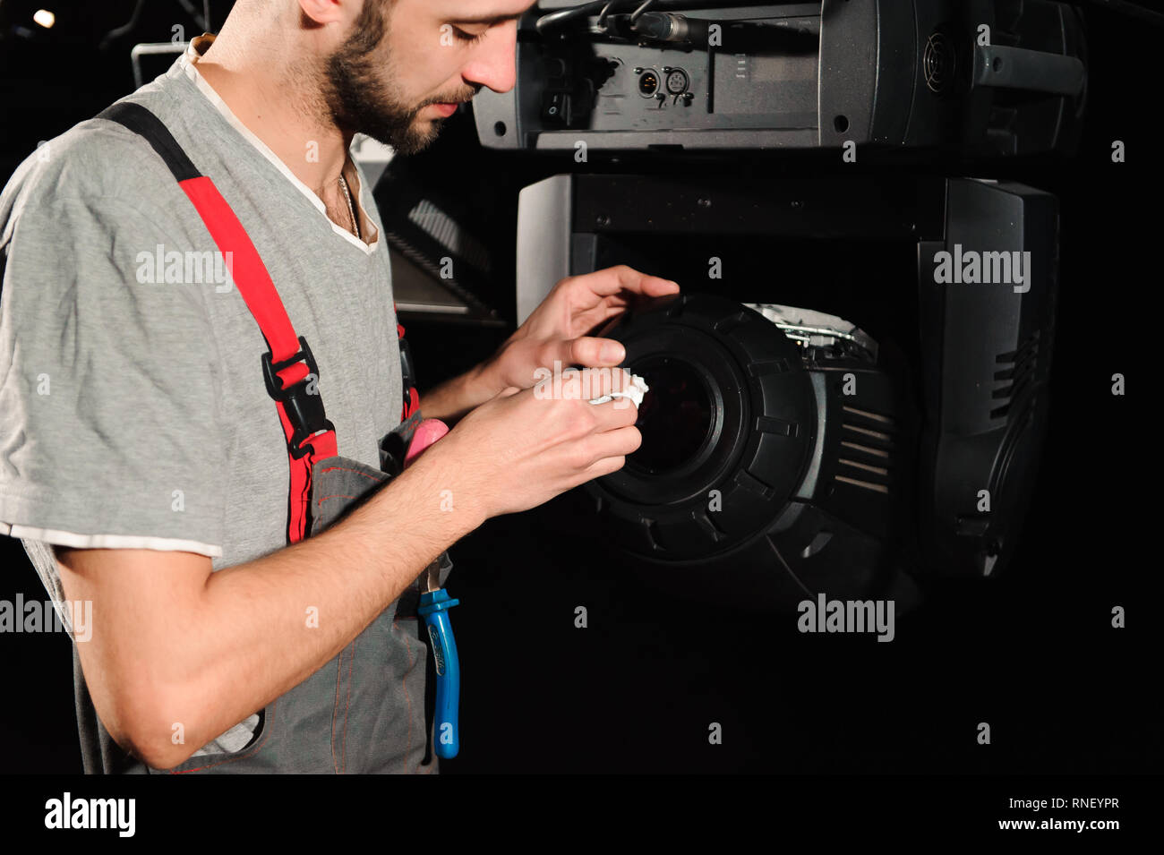 The equipment repair engineer diagnoses the breakdown of light Stock ...