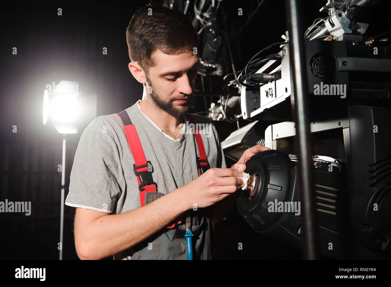 The equipment repair engineer diagnoses the breakdown of light Stock ...