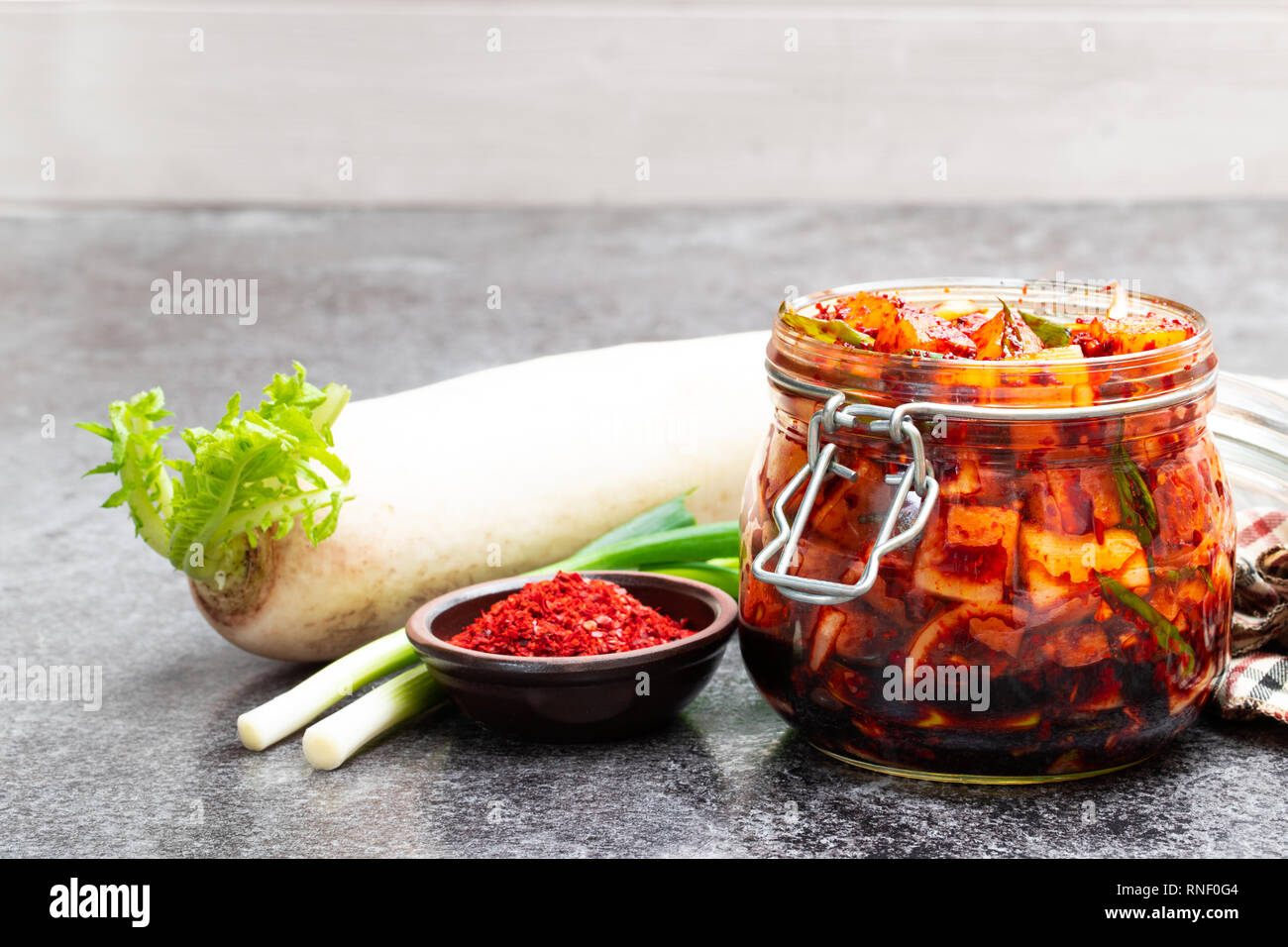 Daikon radish kimchi korean food on gray table Stock Photo - Alamy
