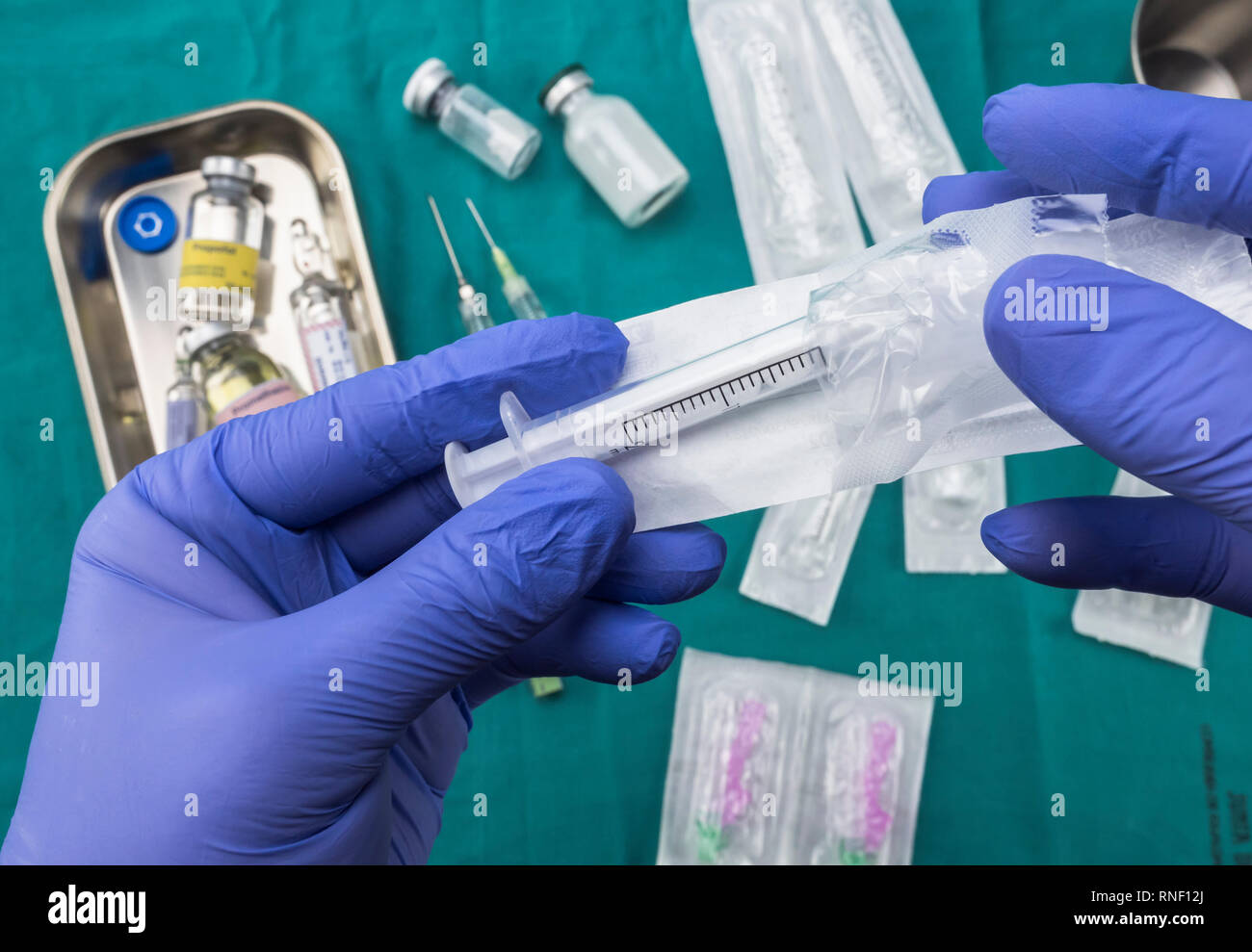 Nurse preparing hospital medication, conceptual image, horizontal ...