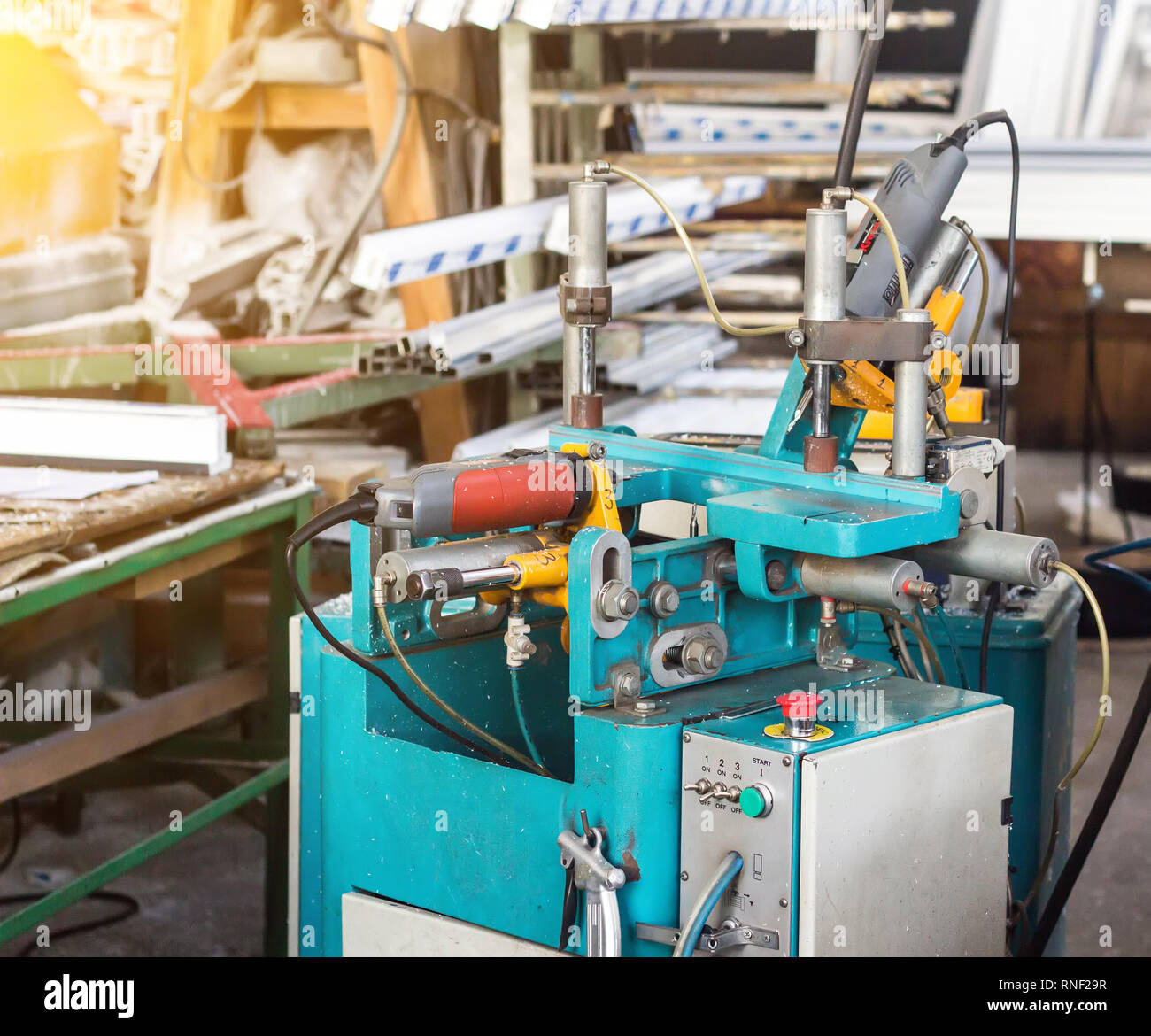 Production of PVC windows, a machine for making holes in the plastic ...