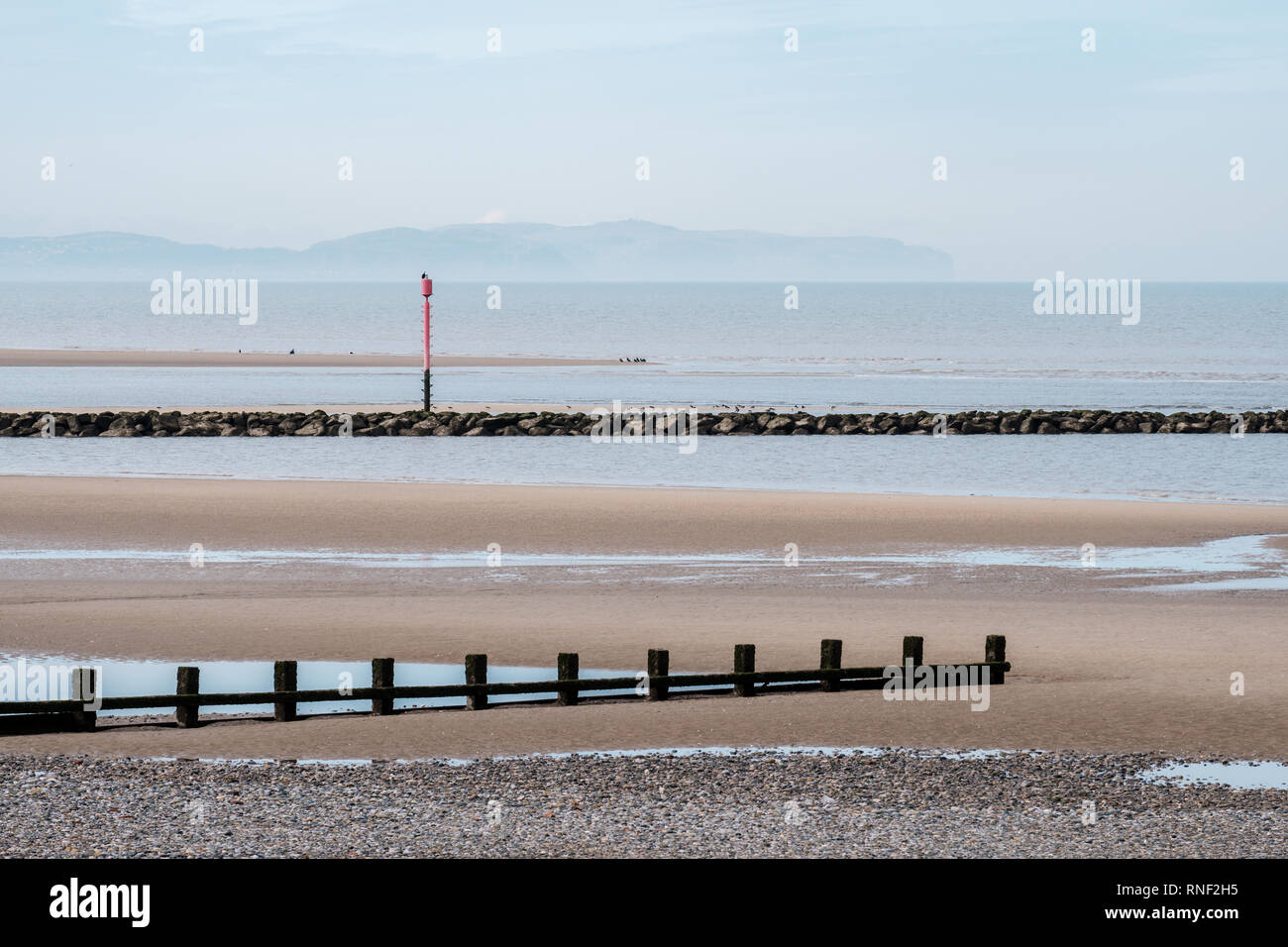 Looking out to sea from Rhyl beach towards the Great Orme of Llandudno ...