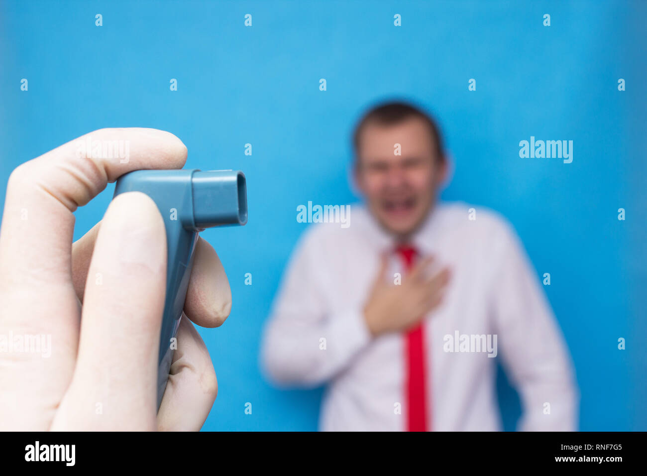 A doctor is holding an asthma inhaler with salbutamol, in the ...