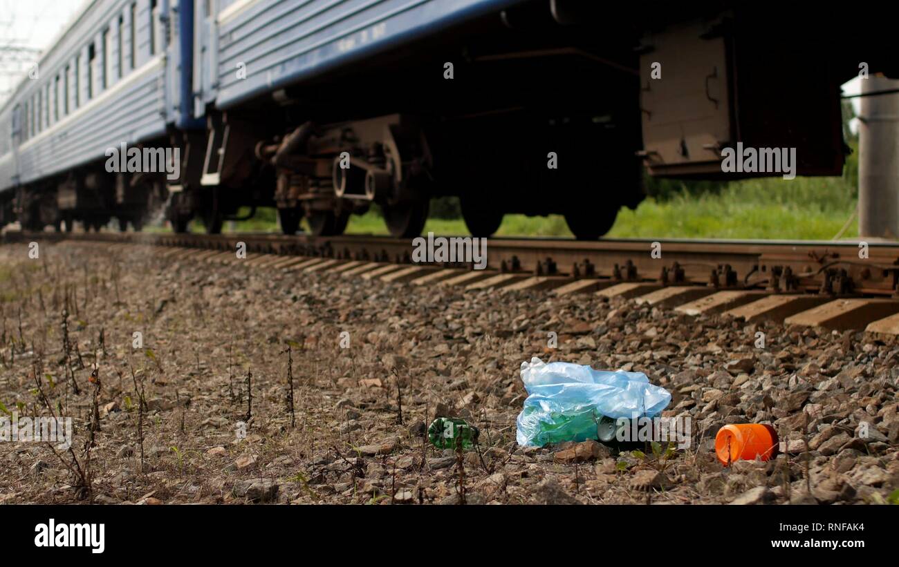 Rubbish on the railway thrown out of the train window, pollution, trash ...