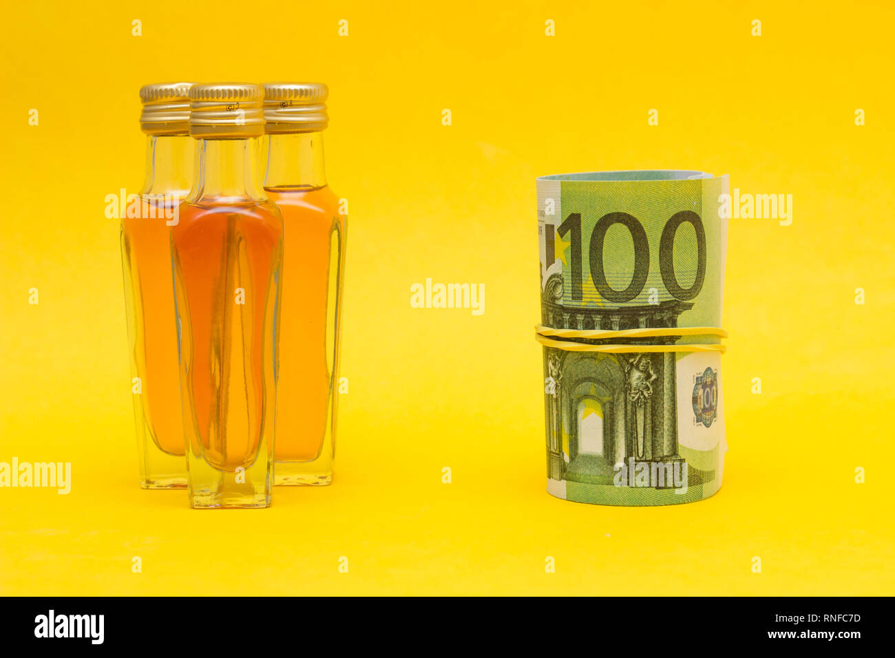Small bottles with alcohol and euro money, income from the alcohol ...