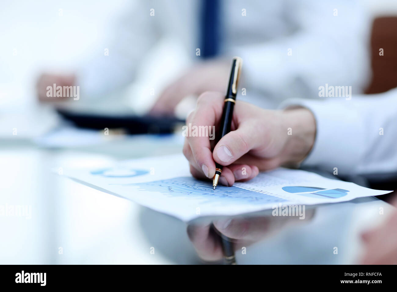 Business man checks chart financial hi-res stock photography and images ...
