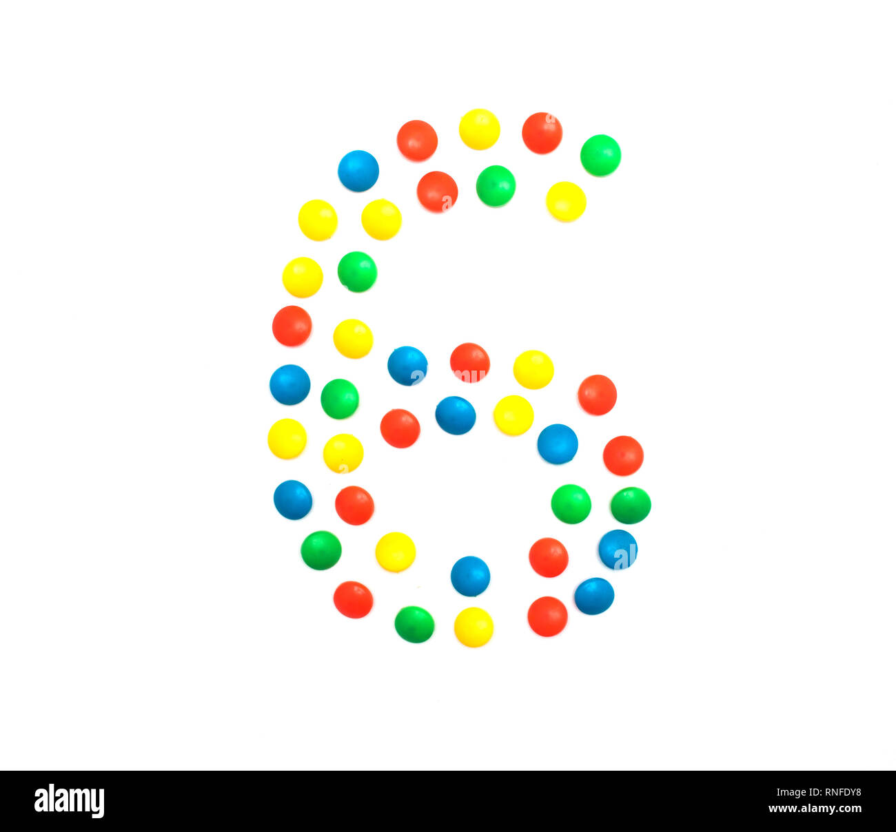 Children's numbers laid out from a multi-colored mosaic figure number 6 ...