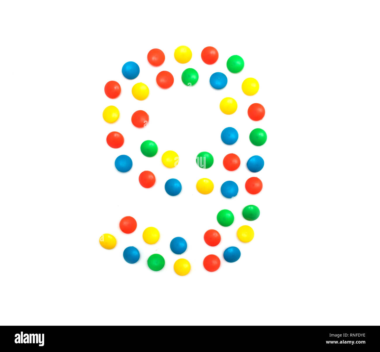 Children's numbers laid out from a multi-colored mosaic figure number 9 ...