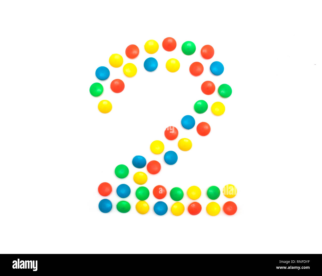 Children's numbers laid out from a multi-colored mosaic figure number 2 ...