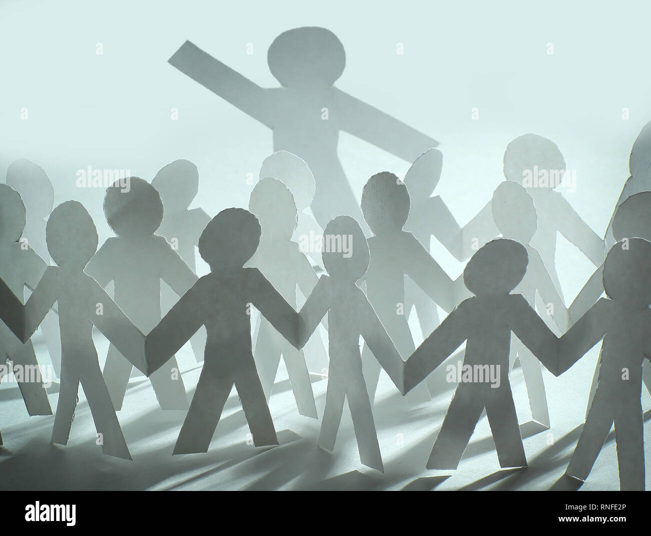 concept of leadership.group of paper men paper background Stock Photo ...